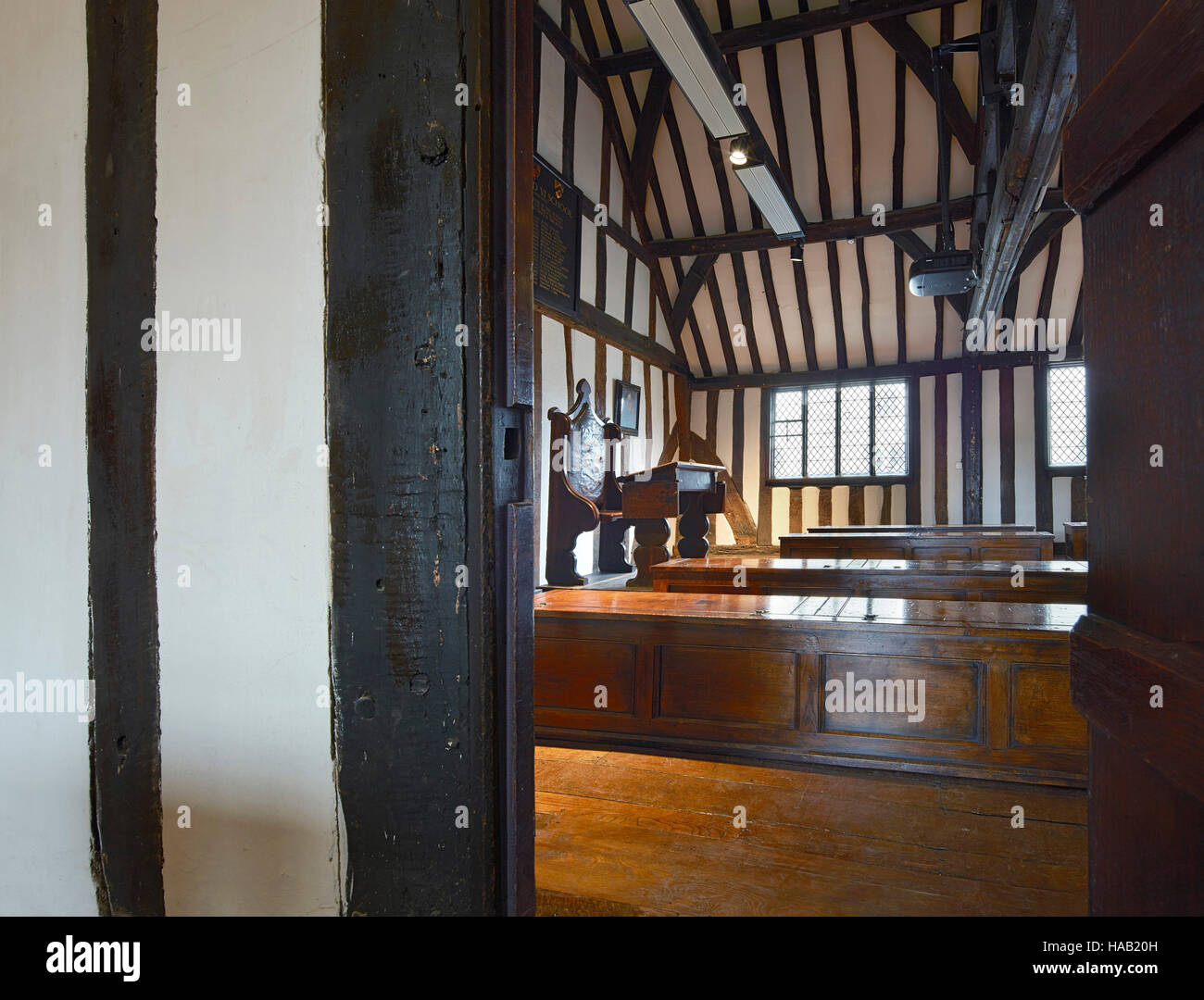 View into classroom with teacher's desk and wooden chests. Shakespeare ...