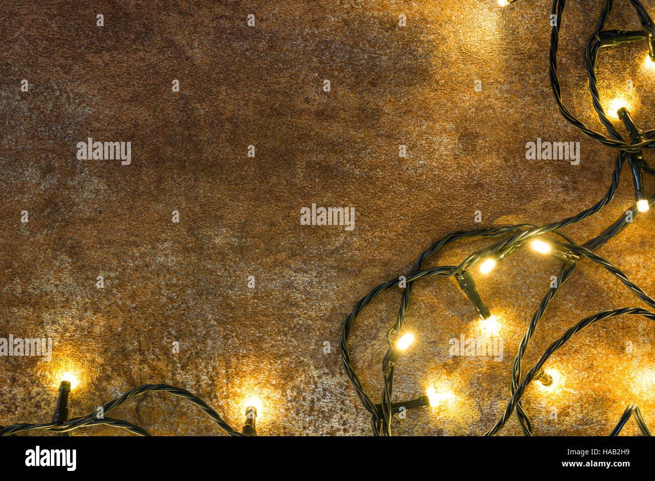 Christmas lights on rusty background Stock Photo - Alamy