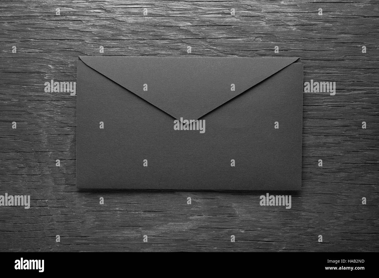 envelope on a black wooden table Stock Photo - Alamy