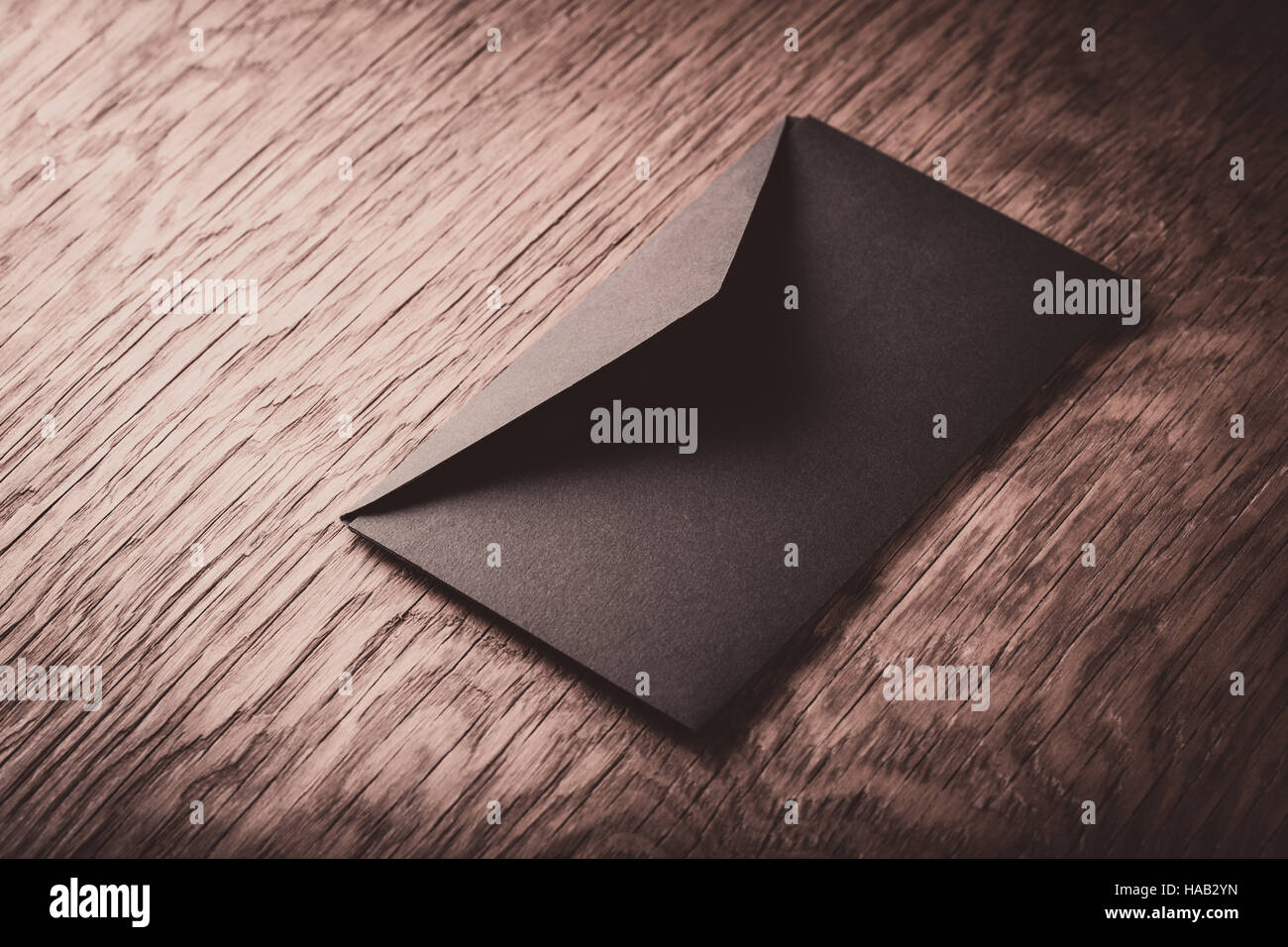 envelope on wooden table Stock Photo - Alamy