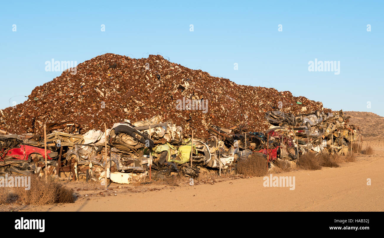 Pile of various scrap cars and other metals on a field ready for the ...