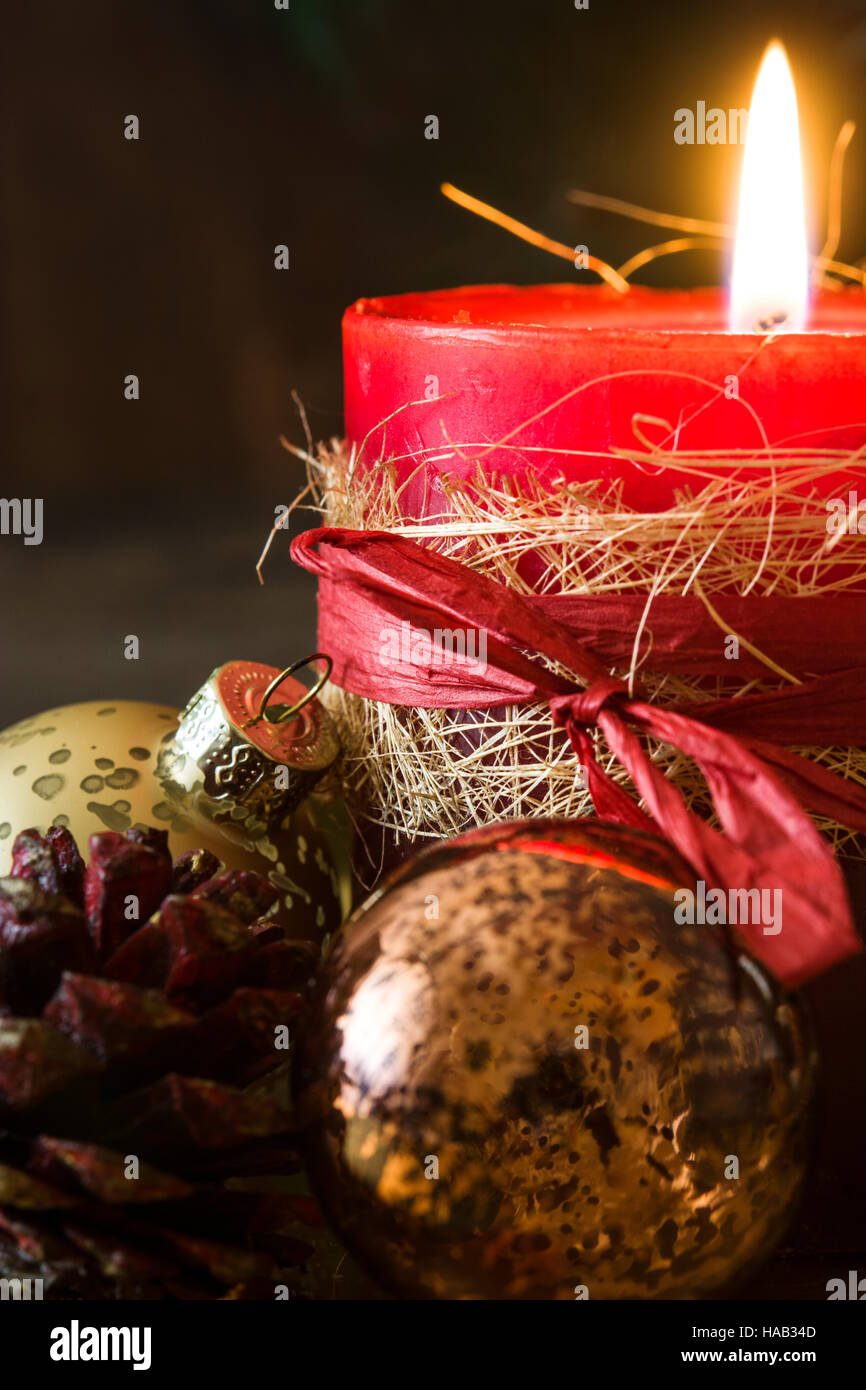 Red Christmas candle and Christmas ornaments Stock Photo - Alamy