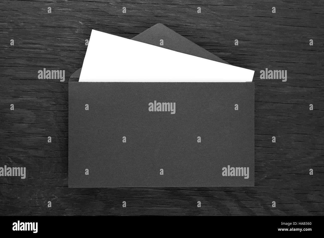envelope on a black wooden table Stock Photo - Alamy