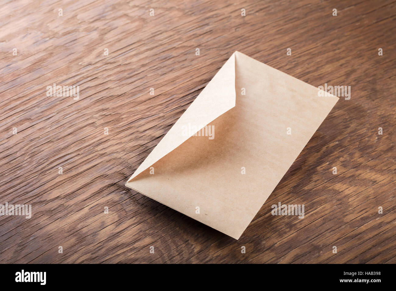 envelope on wooden table Stock Photo - Alamy
