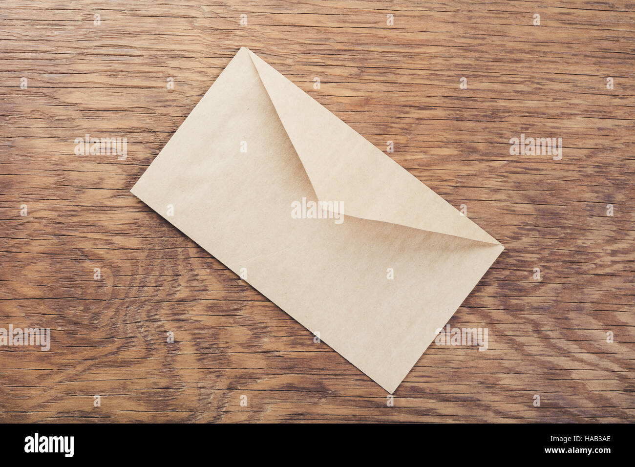 envelope on wooden table Stock Photo - Alamy