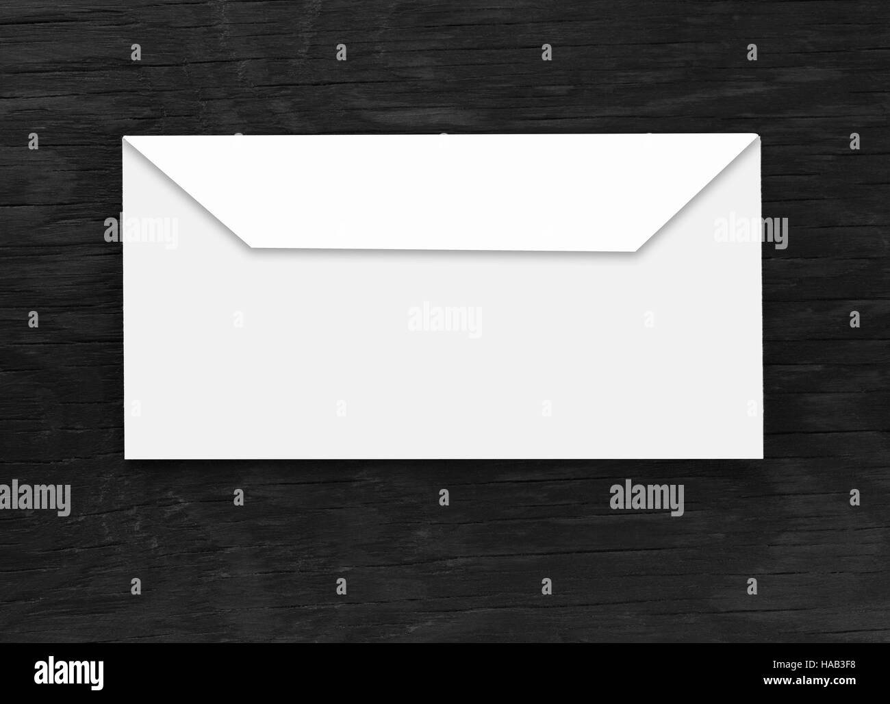 envelope on black wooden table Stock Photo - Alamy