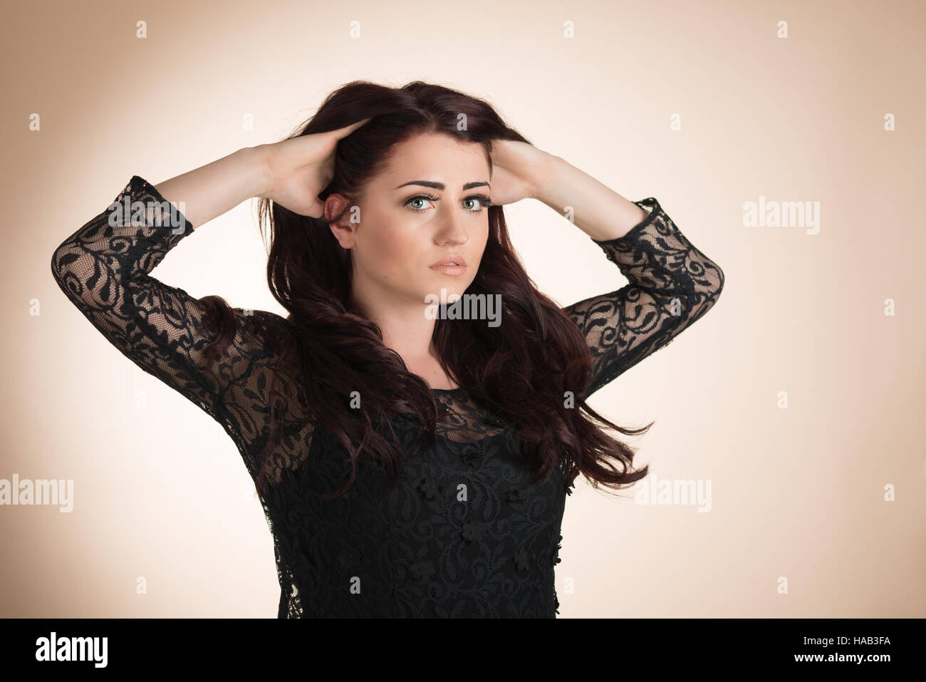 Beauty portrait of young healthy woman with hands in her hair Stock ...