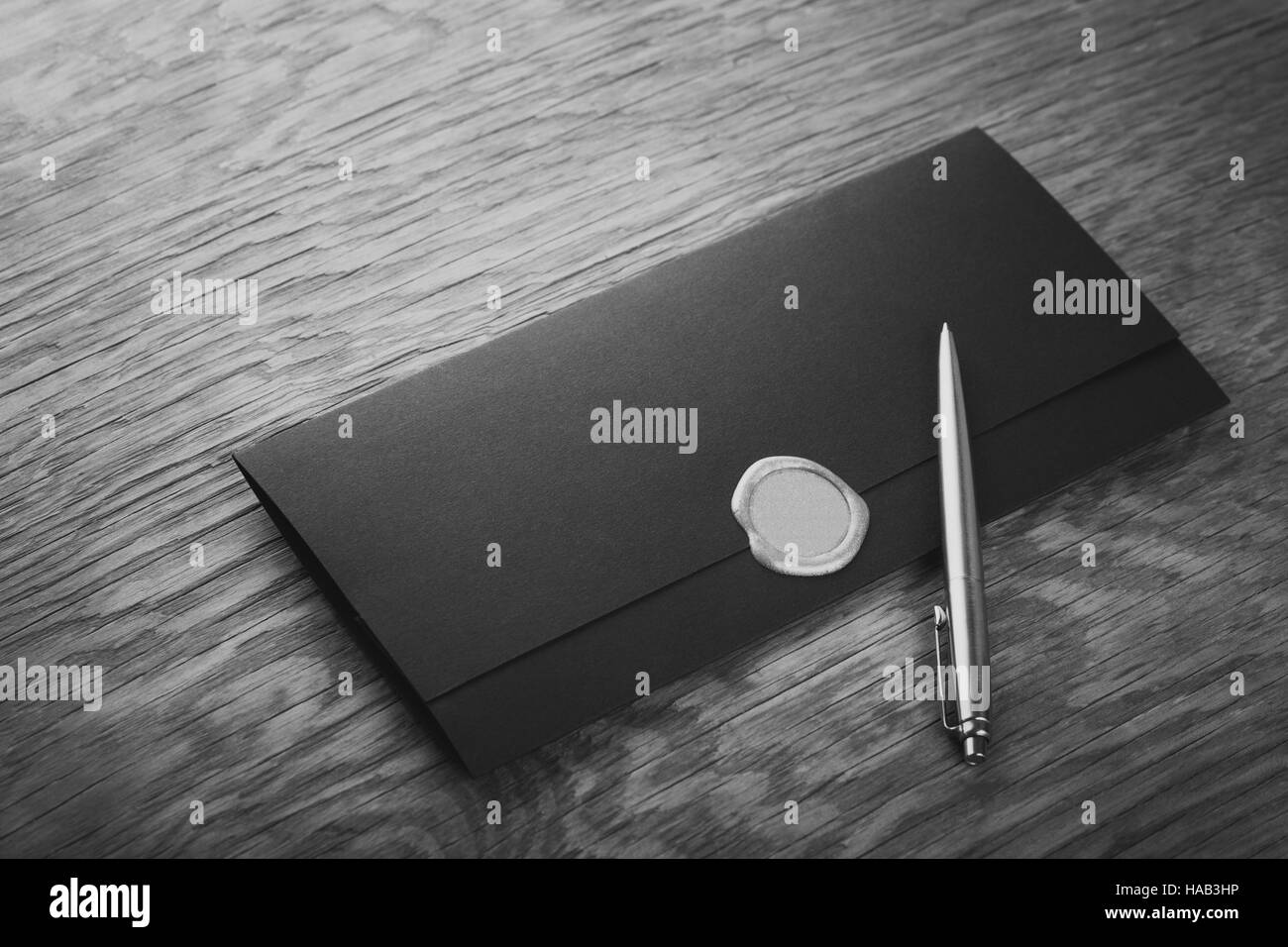 envelope with stamp and pen on the wooden table Stock Photo - Alamy