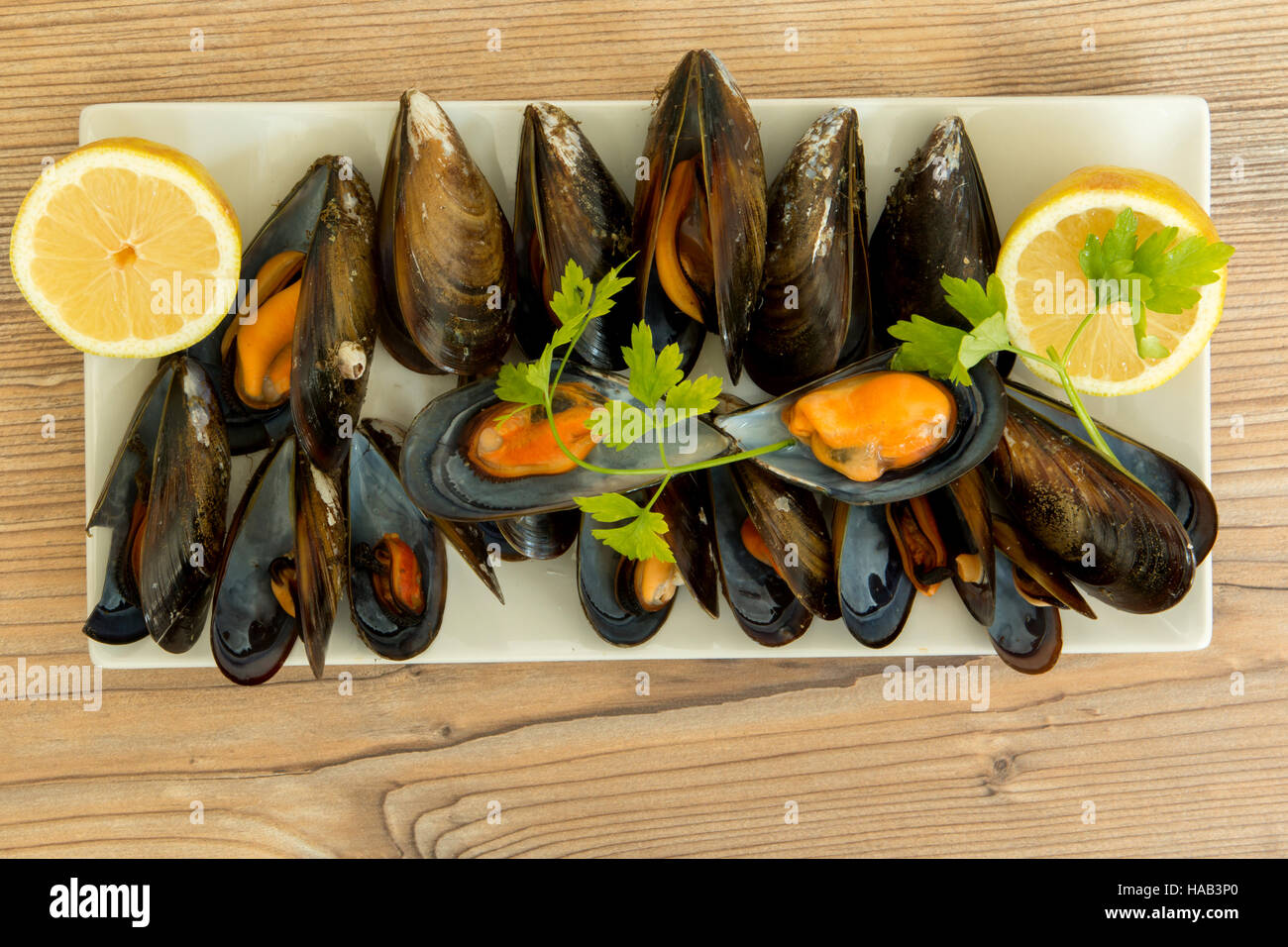 From the sea to the table. Delicious mussel dish Stock Photo - Alamy