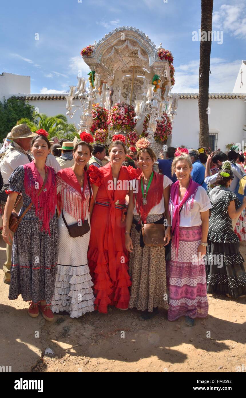 Women with typical dresses in way of pilgrimage El Rocio in front of ...