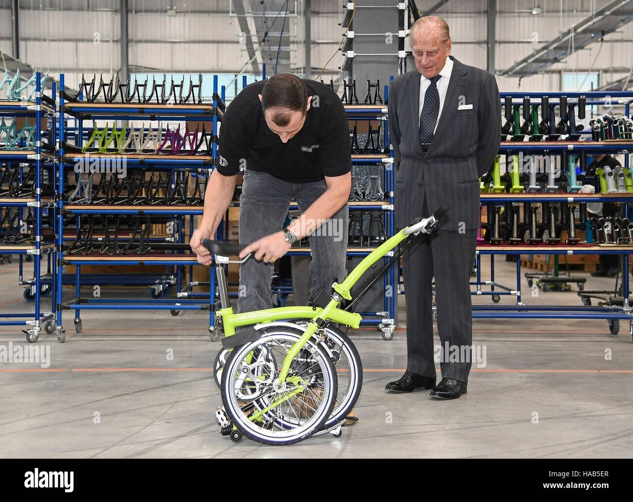 The Duke of Edinburgh is shown a Brompton bicycle by the company's CEO ...