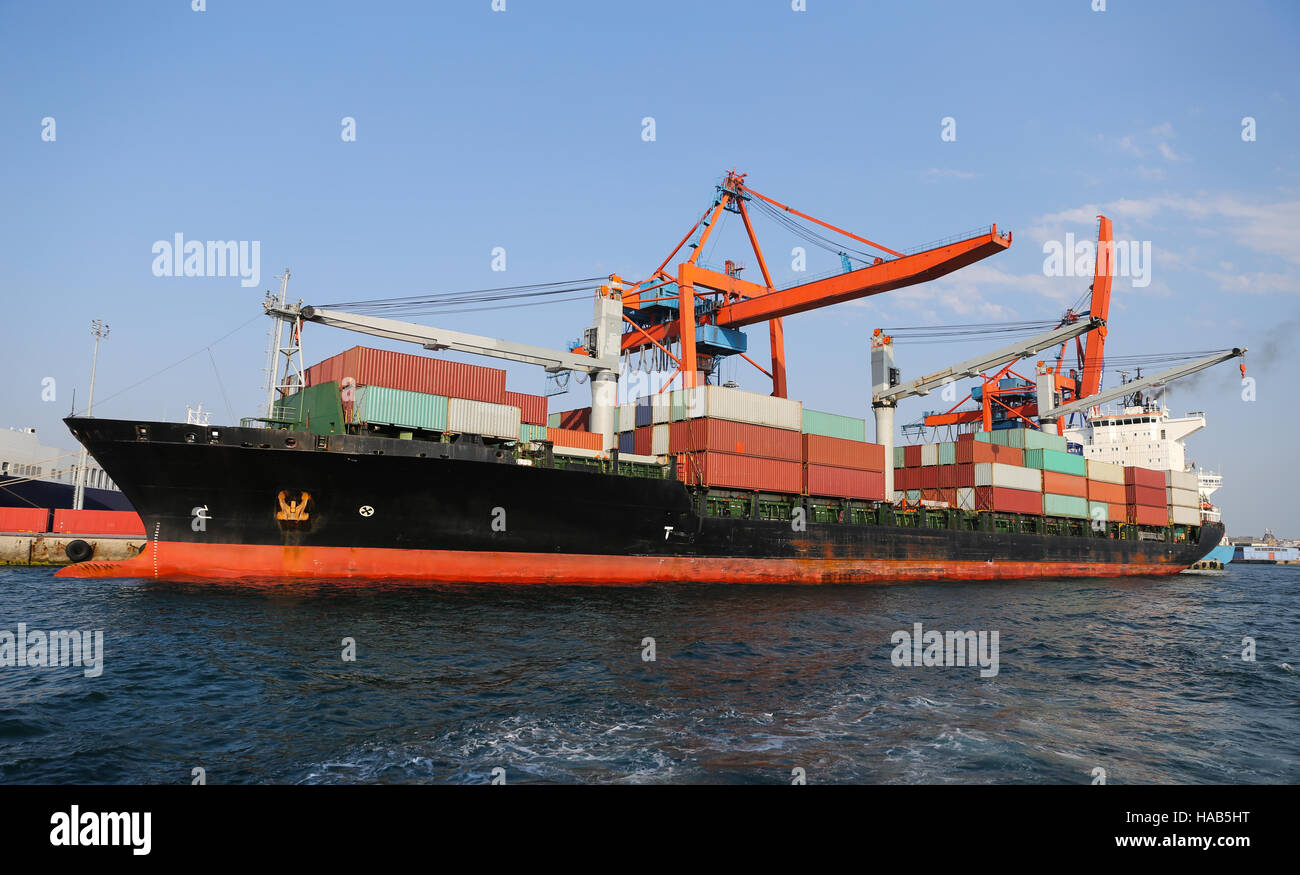 Container Ship is loading in a port Stock Photo - Alamy
