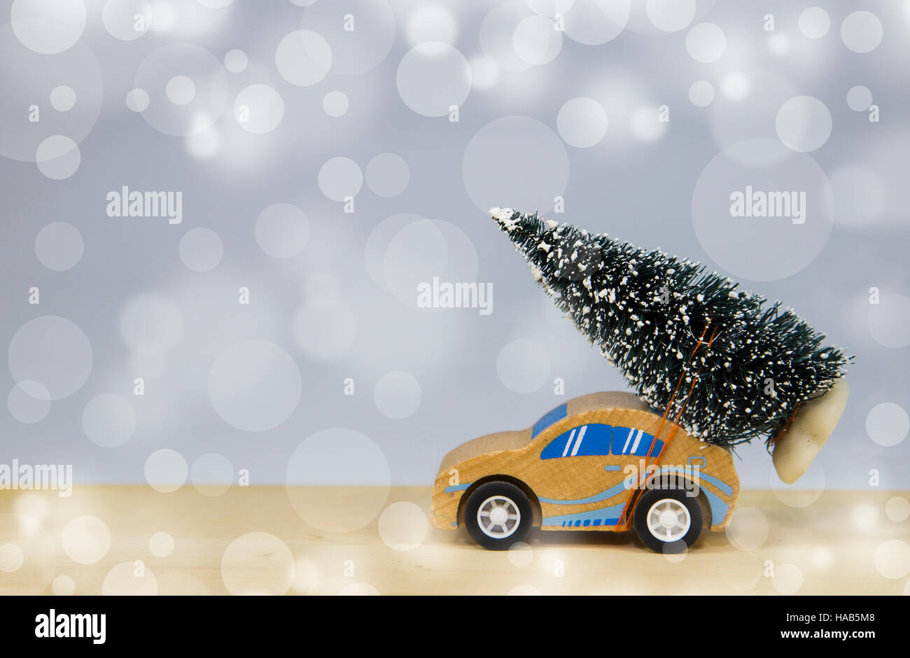Car carrying a Christmas tree Stock Photo - Alamy