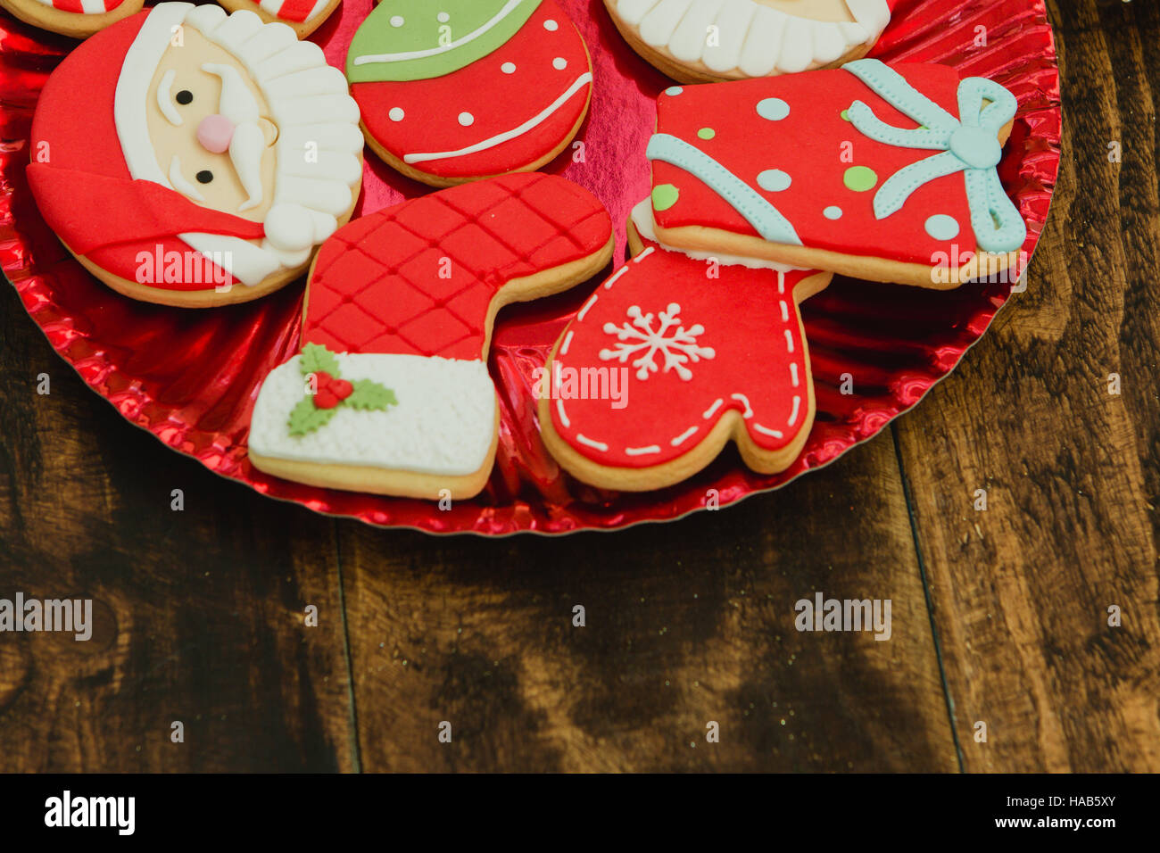 Beautiful cookies for Christmas in red on a wooden background Stock ...