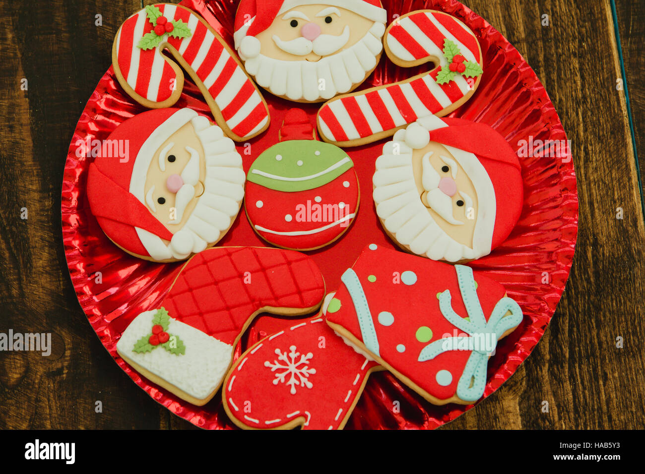 Beautiful cookies for Christmas in red on a wooden background Stock ...