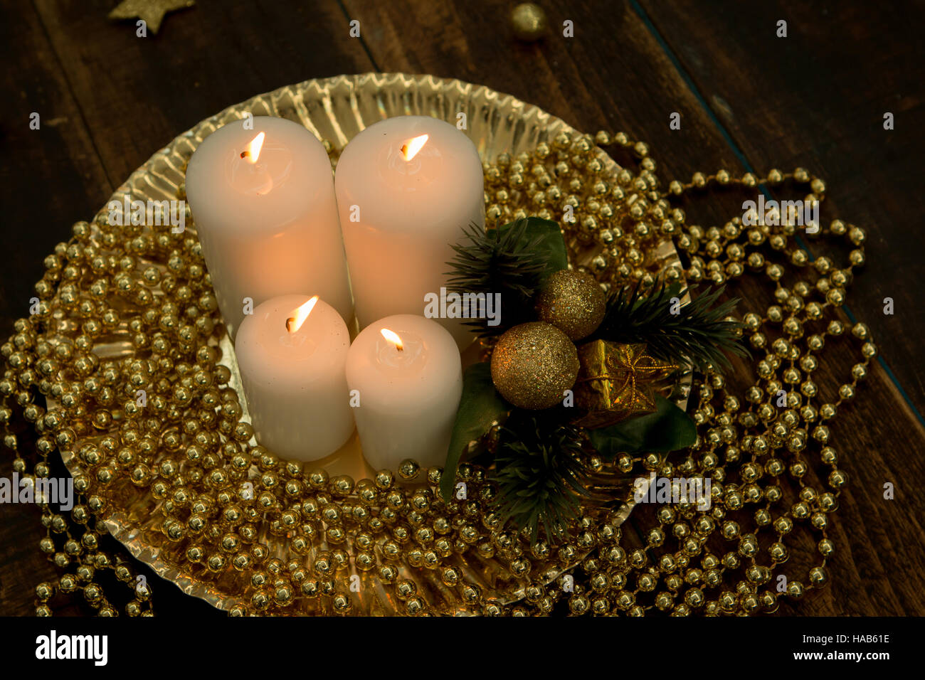 White candles on a rustic wooden background Stock Photo - Alamy