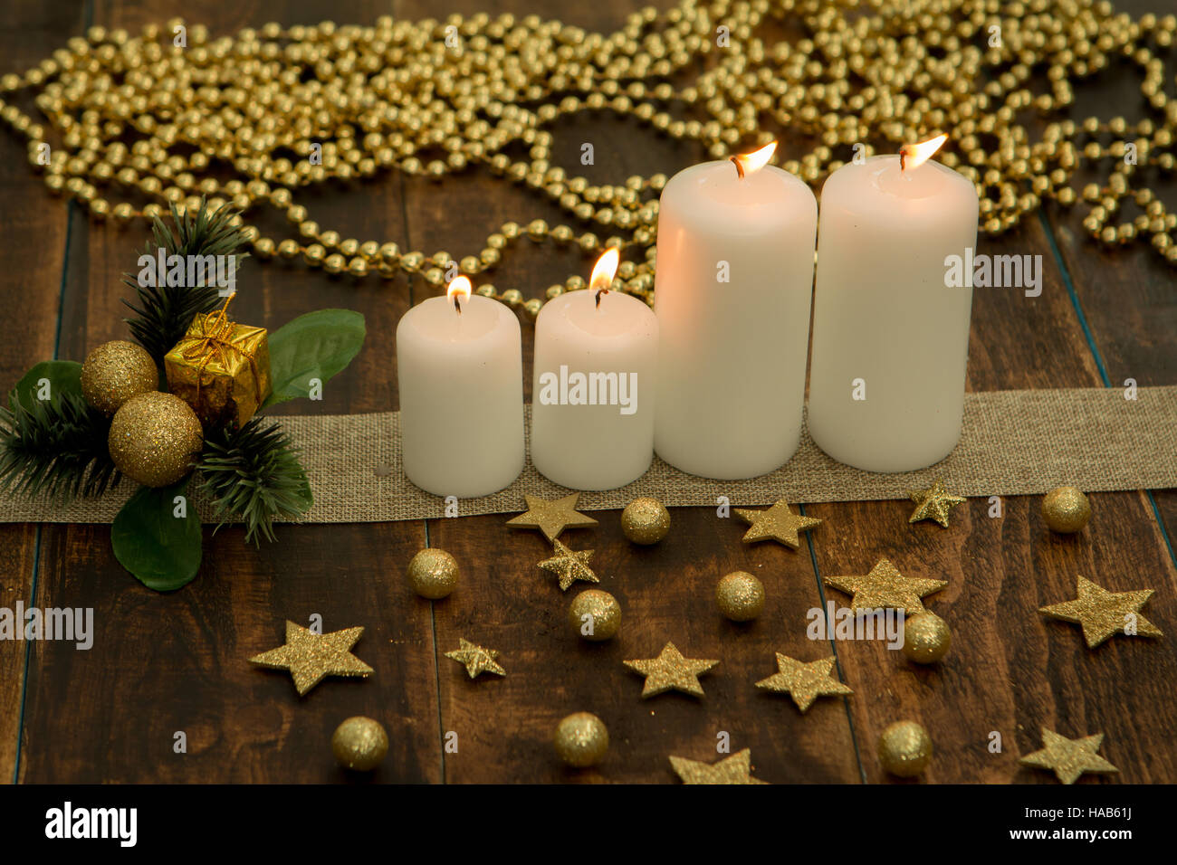 White candles on a rustic wooden background Stock Photo - Alamy
