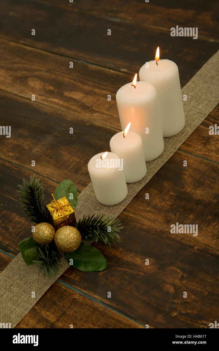 White candles on a rustic wooden background Stock Photo - Alamy