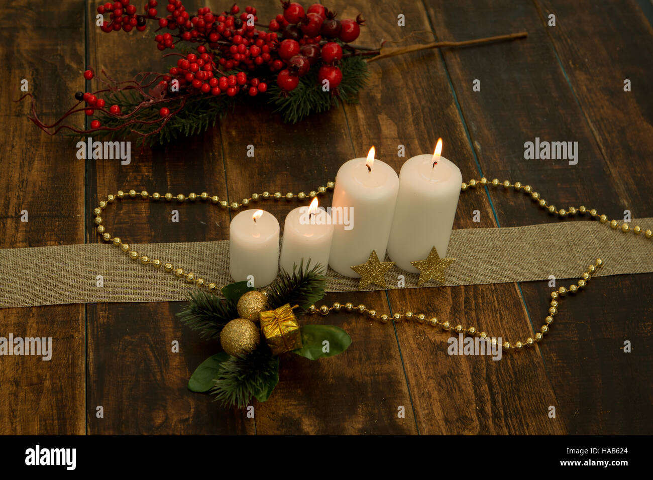 White candles on a rustic wooden background Stock Photo - Alamy