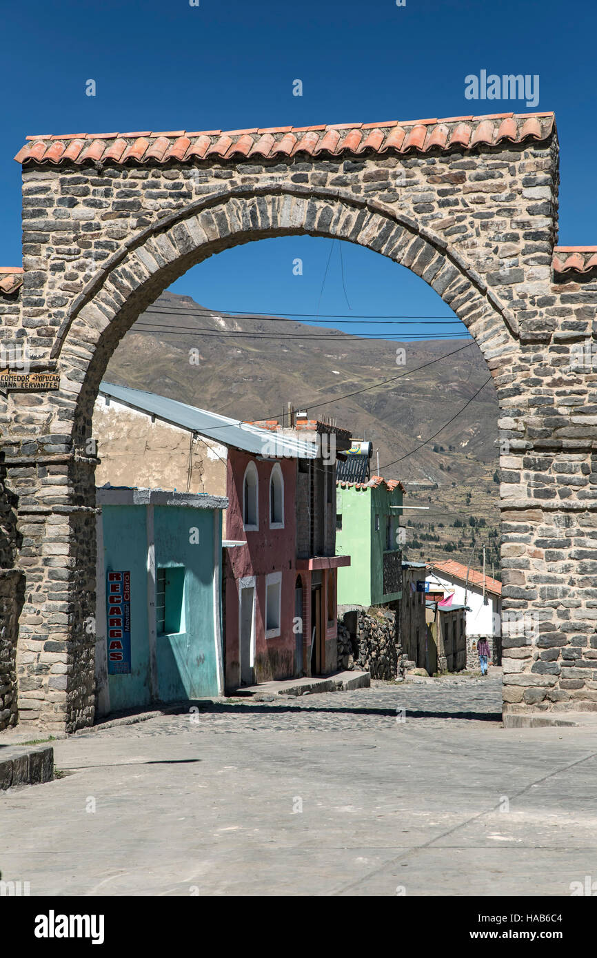 Brick arch at entrance to plaza, Corporaque, Colca Canyon, Arequipa ...