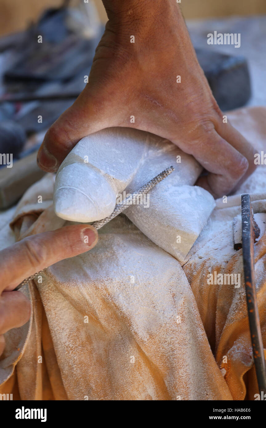 hand of an expert craftsman and stone sculpting Stock Photo - Alamy