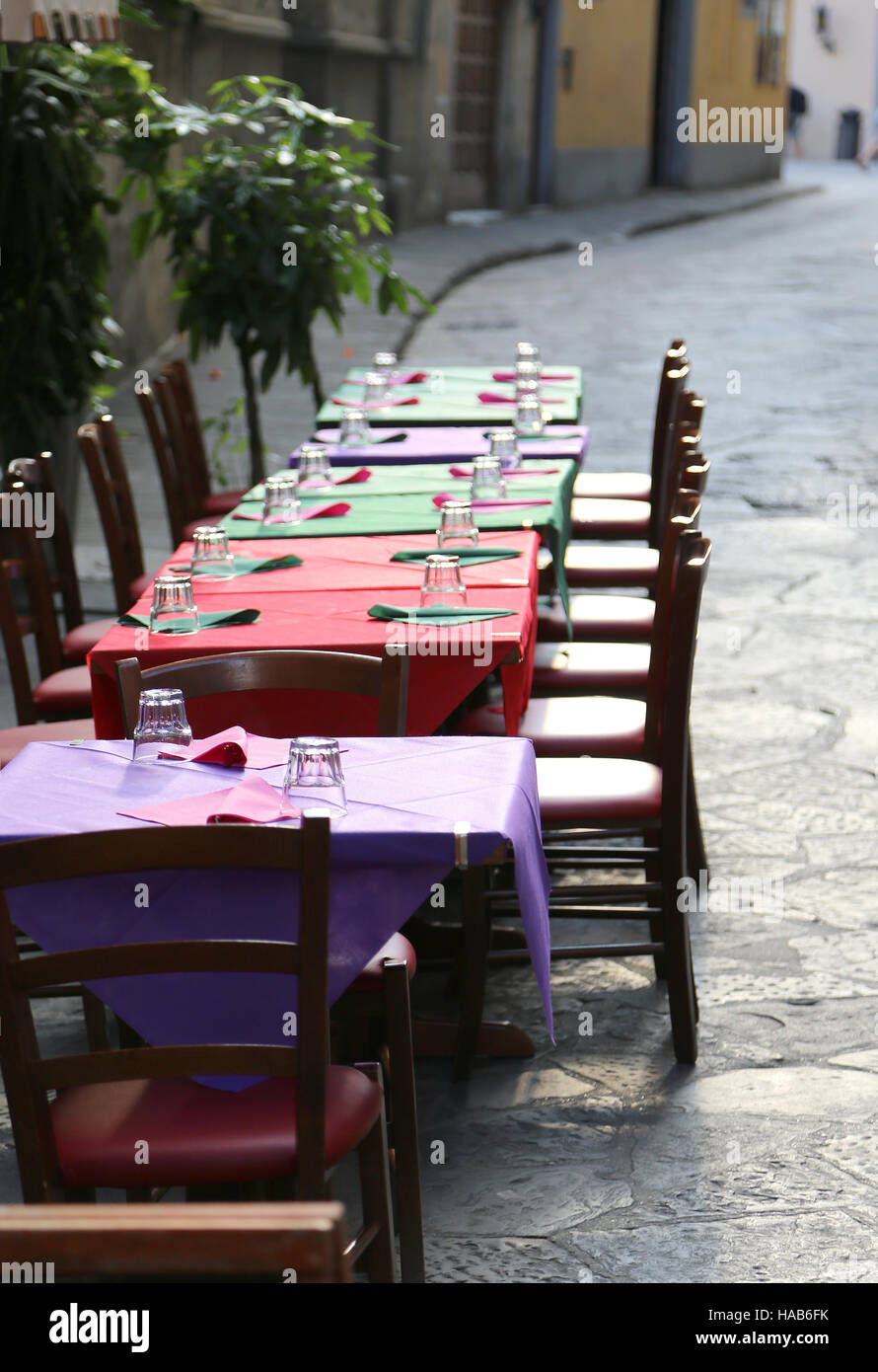 outdoor restaurant with the tables prepared along the pedestrian street ...