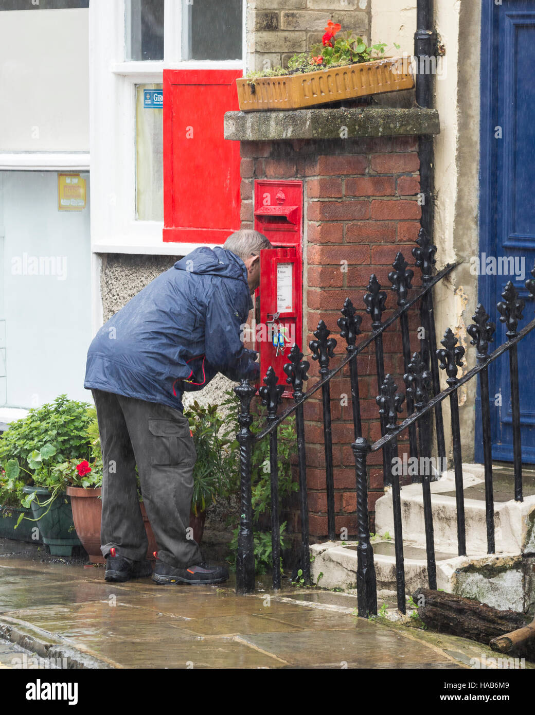 Postbox postman hi-res stock photography and images - Alamy