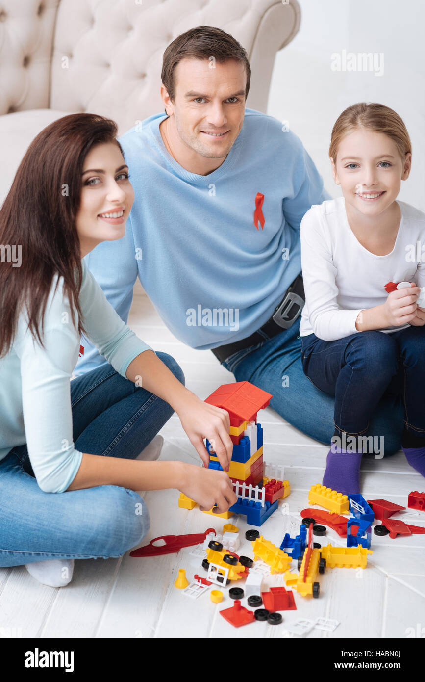 Close knit pleasant family enjoying their time together Stock Photo - Alamy