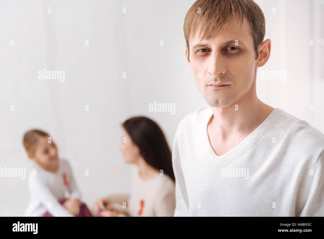 Pale serious man looking at you Stock Photo - Alamy