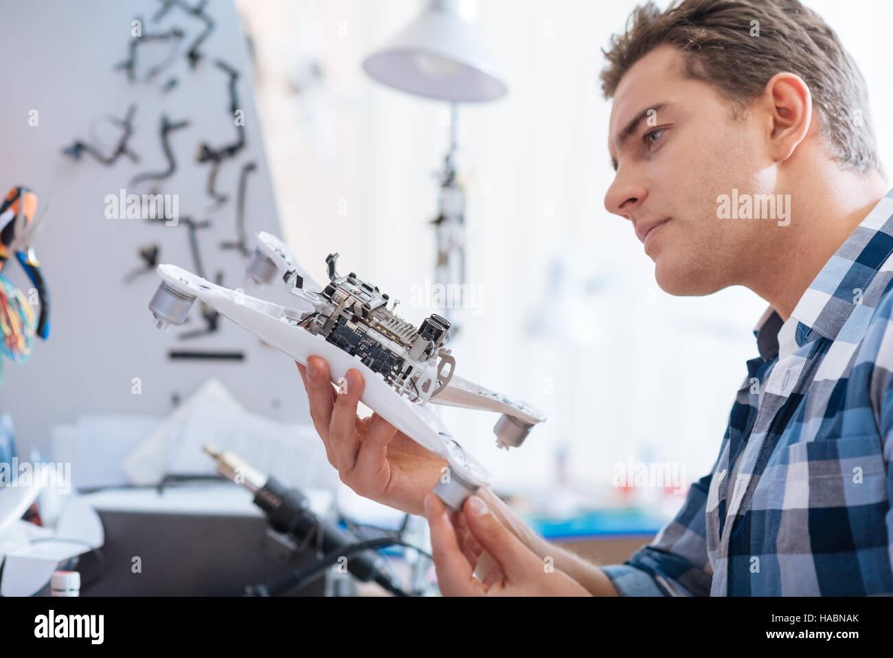 Concentrated man holsing drone detail Stock Photo - Alamy