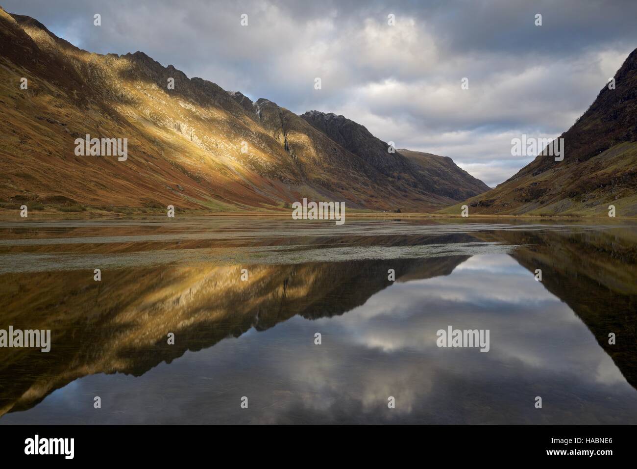Colour reflections of Loch Achtrocitan in Glencoe Stock Photo - Alamy