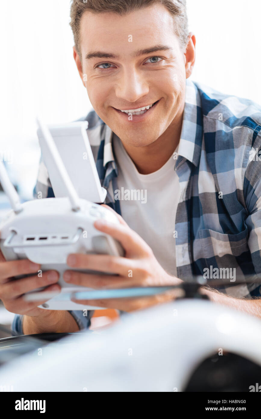 Happy man holding drone remote controller Stock Photo - Alamy