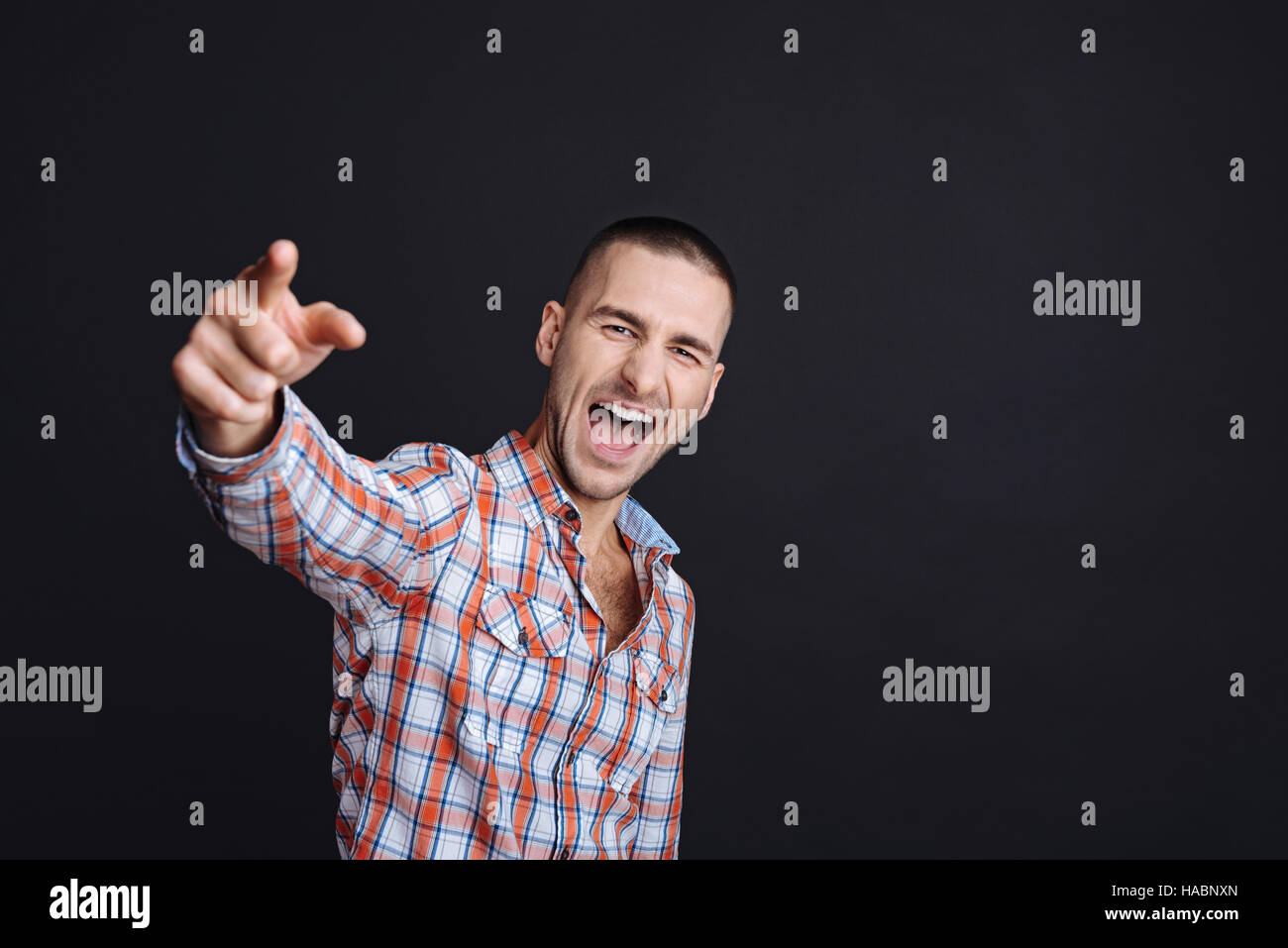 Young delighted man keeping his mouth opened Stock Photo - Alamy