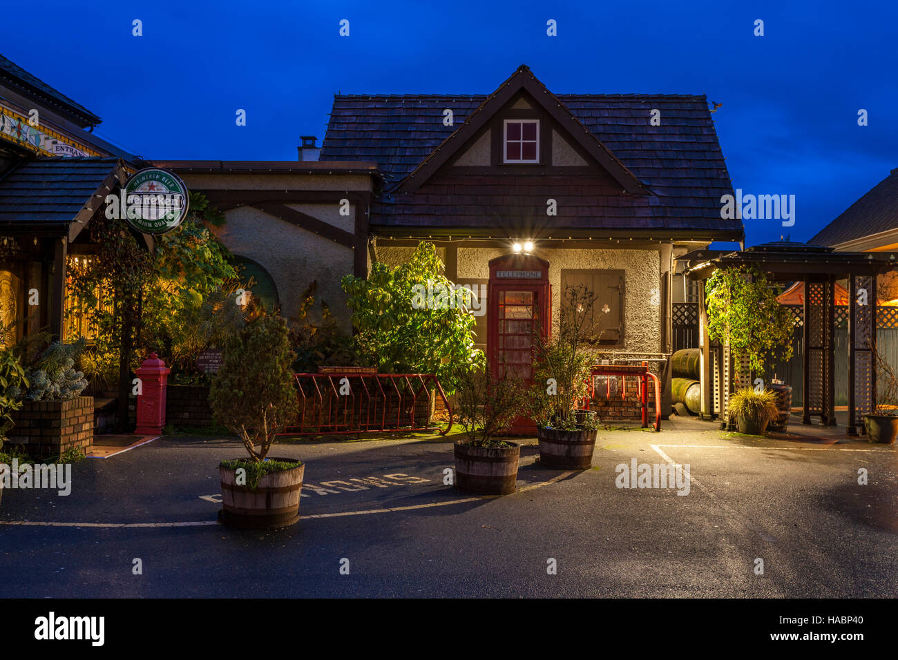 Six Mile Pub and old style British telephone booth at twilight-View ...