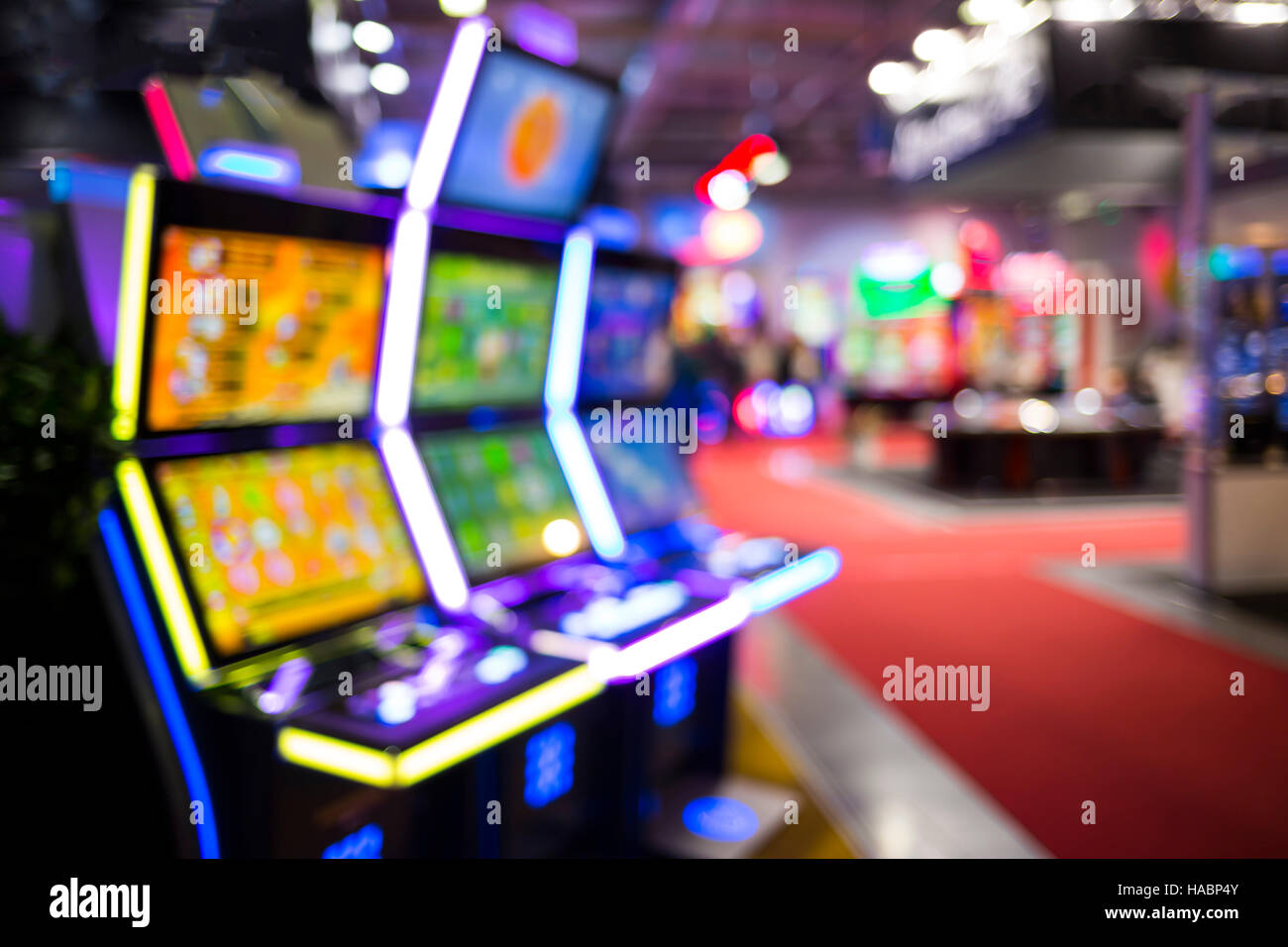 Blurry image of slots machines and other gambling equipment at a casino ...