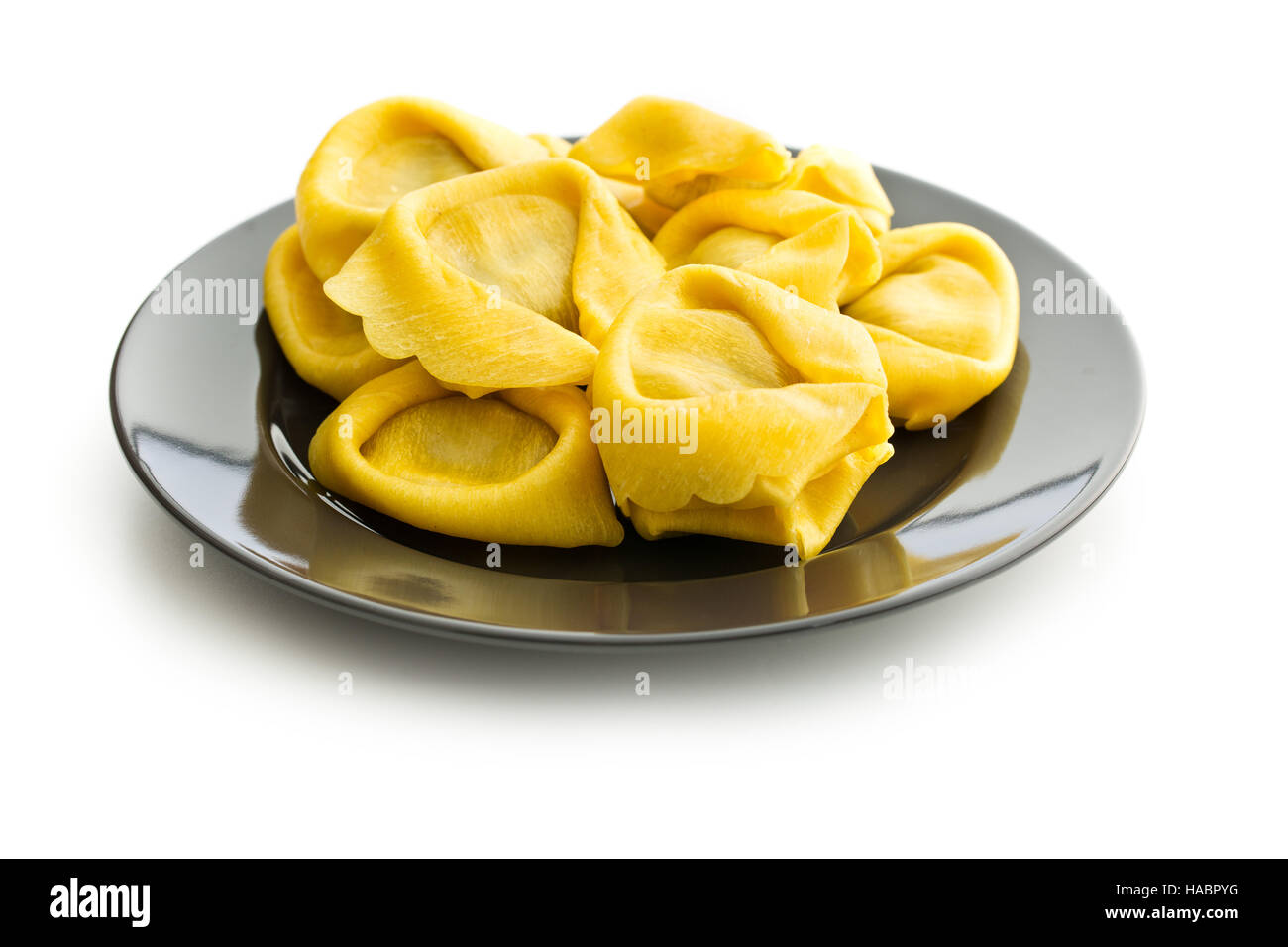 Italian traditional tortellini pasta on plate isolated on white ...