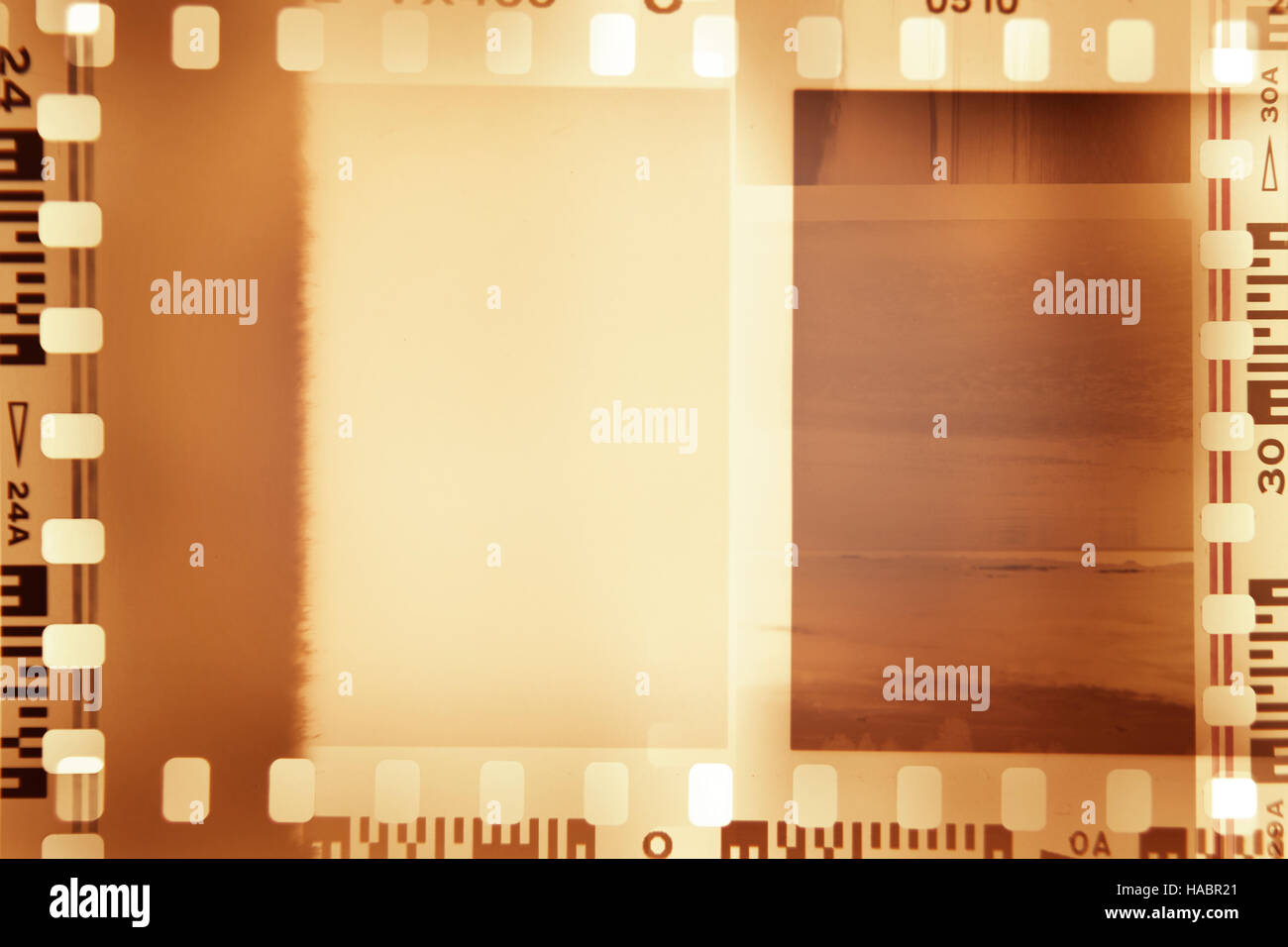 Film negative frames on brown background Stock Photo - Alamy