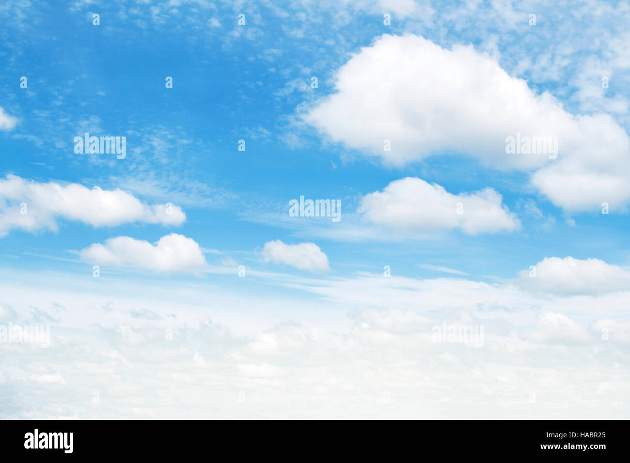 Fluffy white clouds in blue sky Stock Photo - Alamy