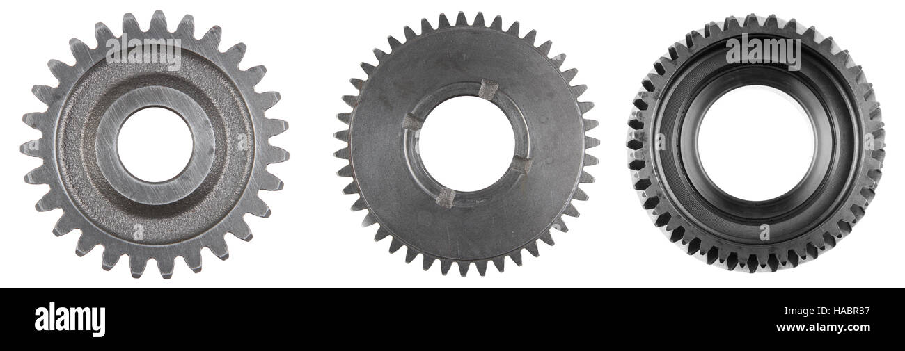 Three metal gears on plain background Stock Photo - Alamy
