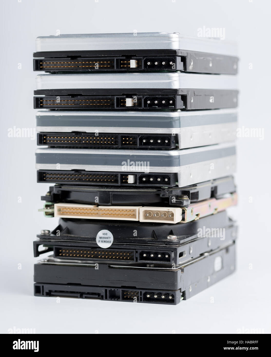 Pile of old hard drive on white background Stock Photo - Alamy