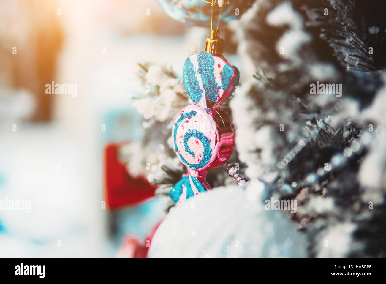 Christmas tree branch with toys Stock Photo - Alamy