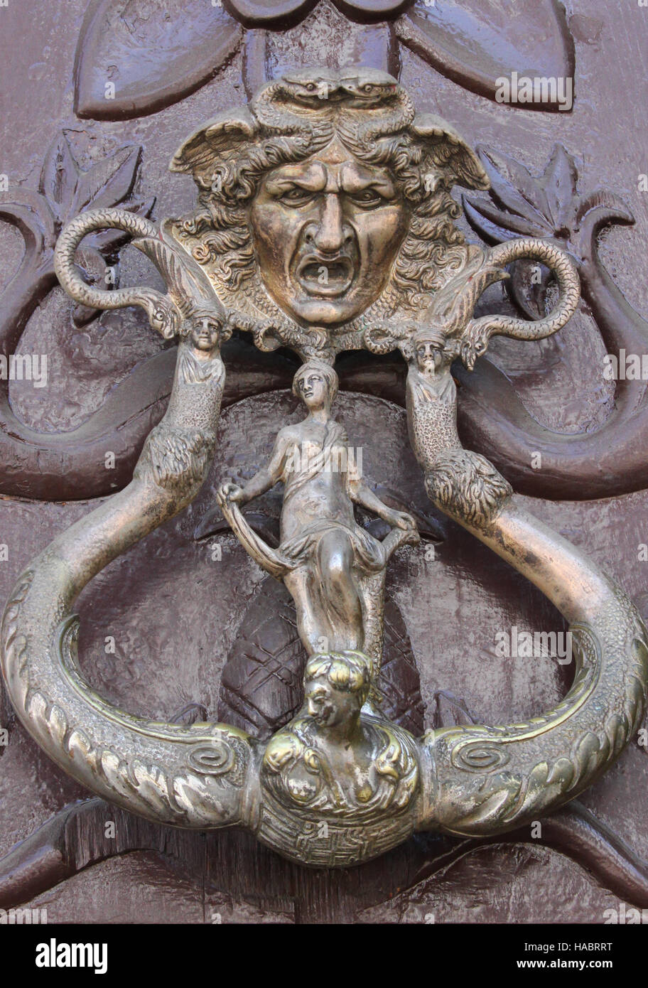 Ornate door knocker with mythical figures in Bolivia Stock Photo - Alamy