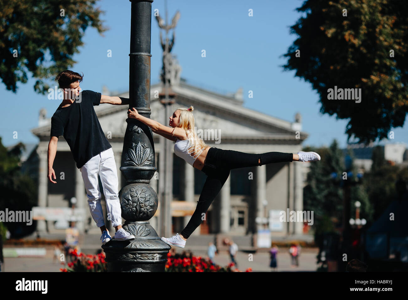 man and woman performing acrobatic tricks Stock Photo - Alamy