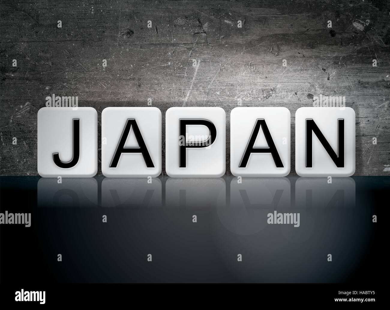 The word "Japan" written in white tiles against a dark vintage grunge ...