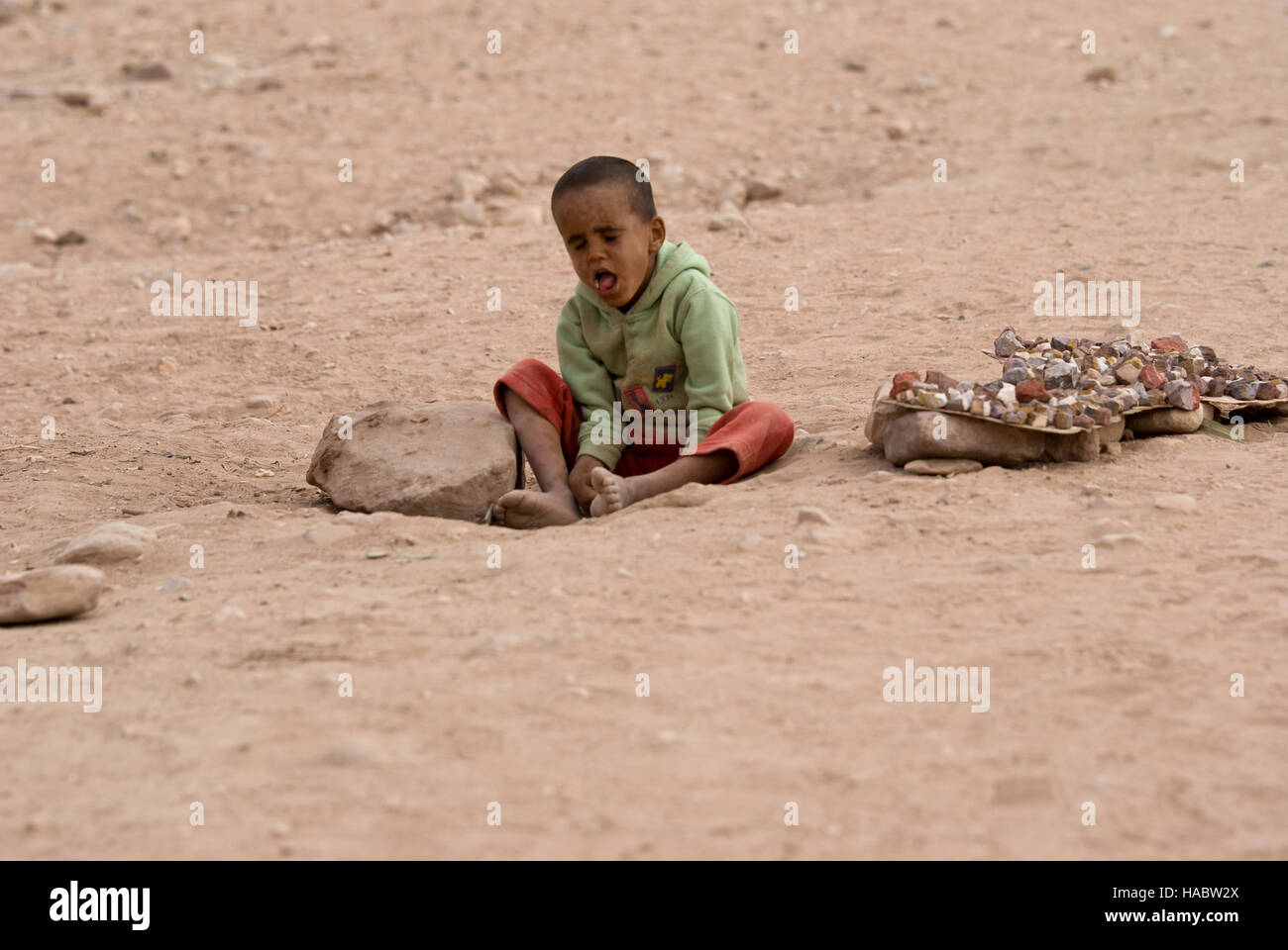 Jordanian Bedouin boy sells souvenirs in Petra, Jordan Stock Photo - Alamy