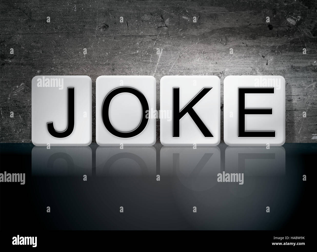 The word "Joke" written in white tiles against a dark vintage grunge ...