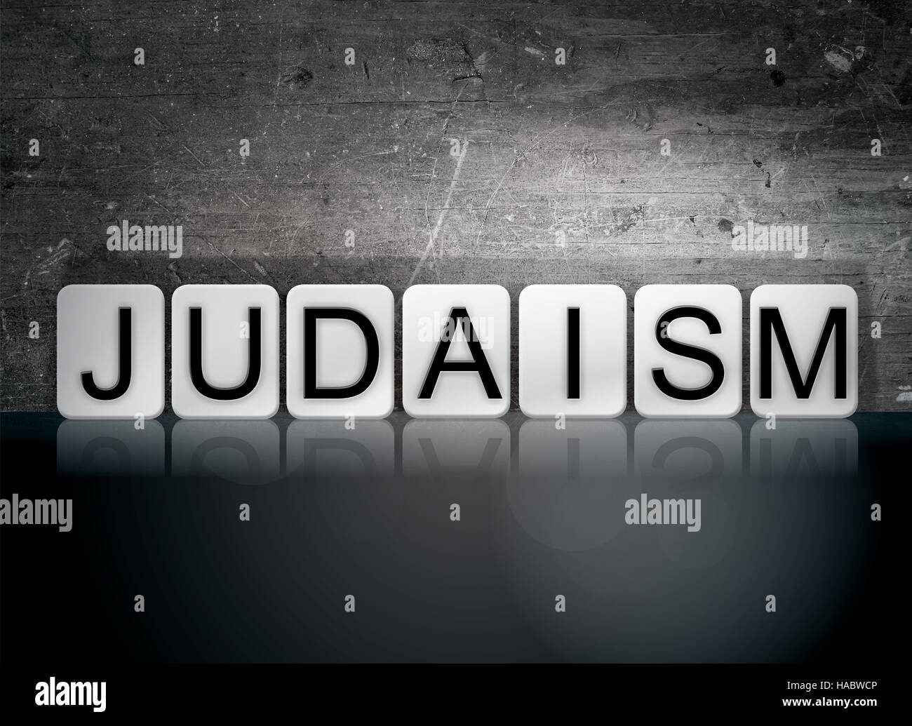 The word "Judaism" written in white tiles against a dark vintage grunge ...
