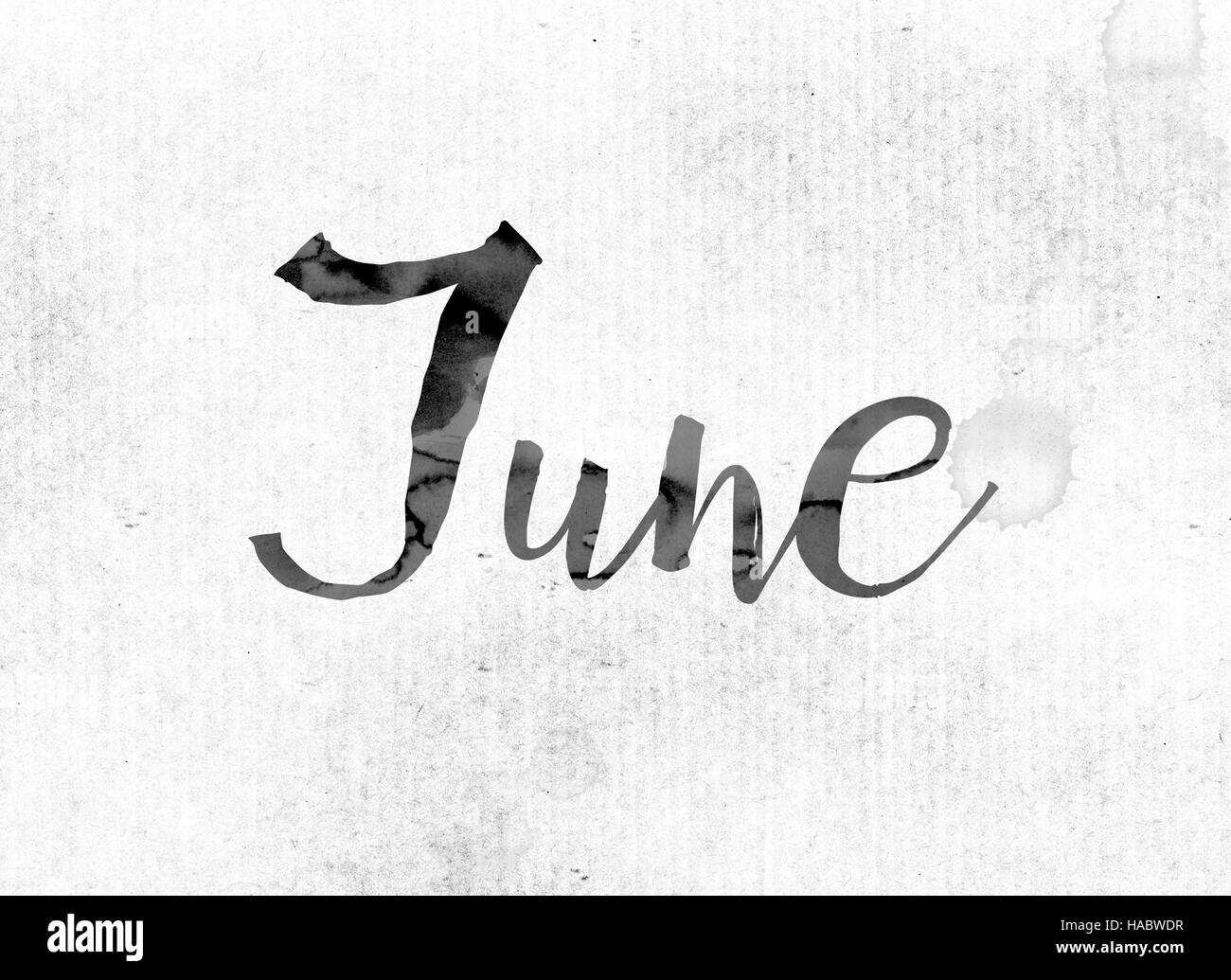 The word "June" concept and theme painted in watercolor ink on a white ...