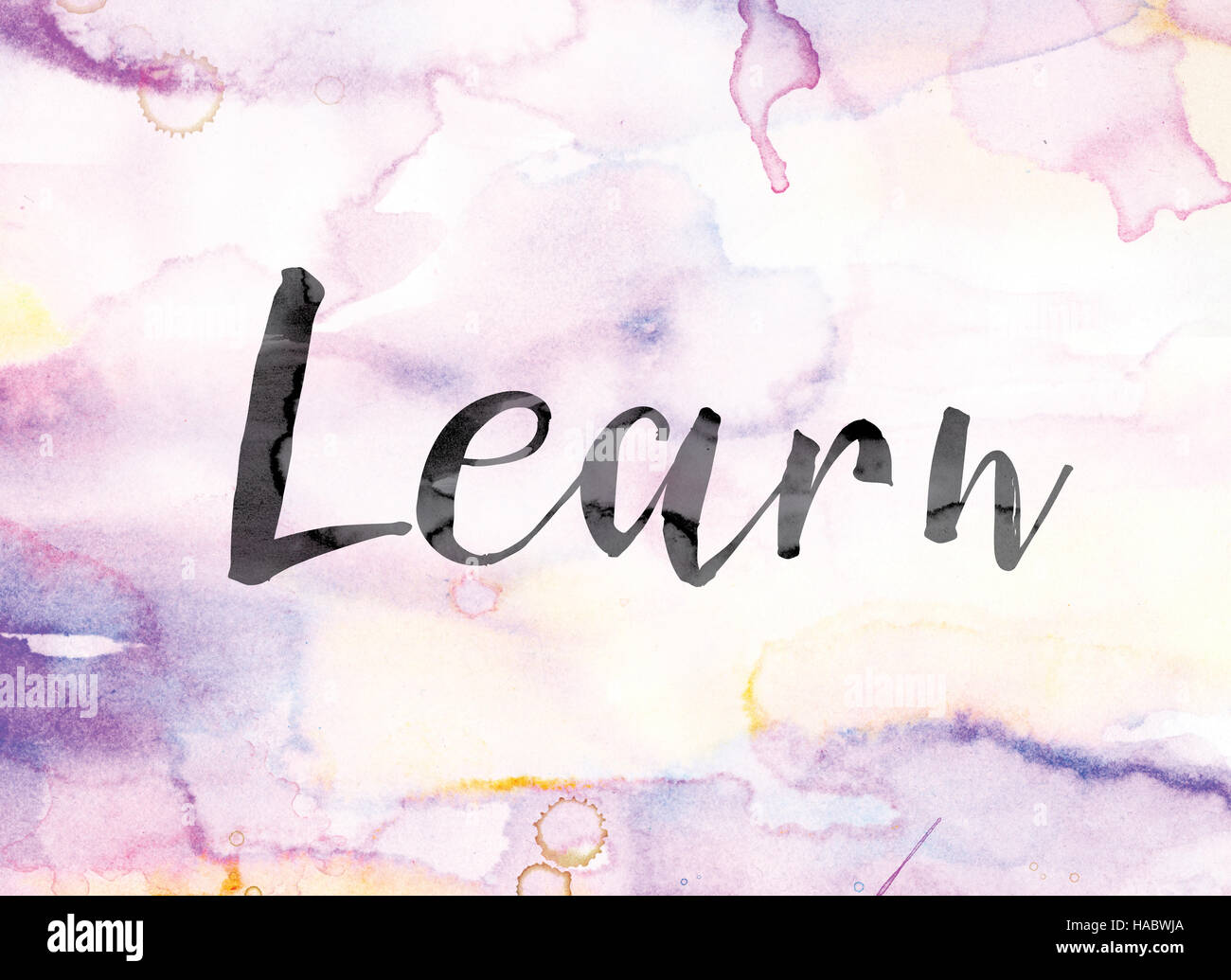 The word "Learn" painted in black ink over a colorful watercolor washed ...