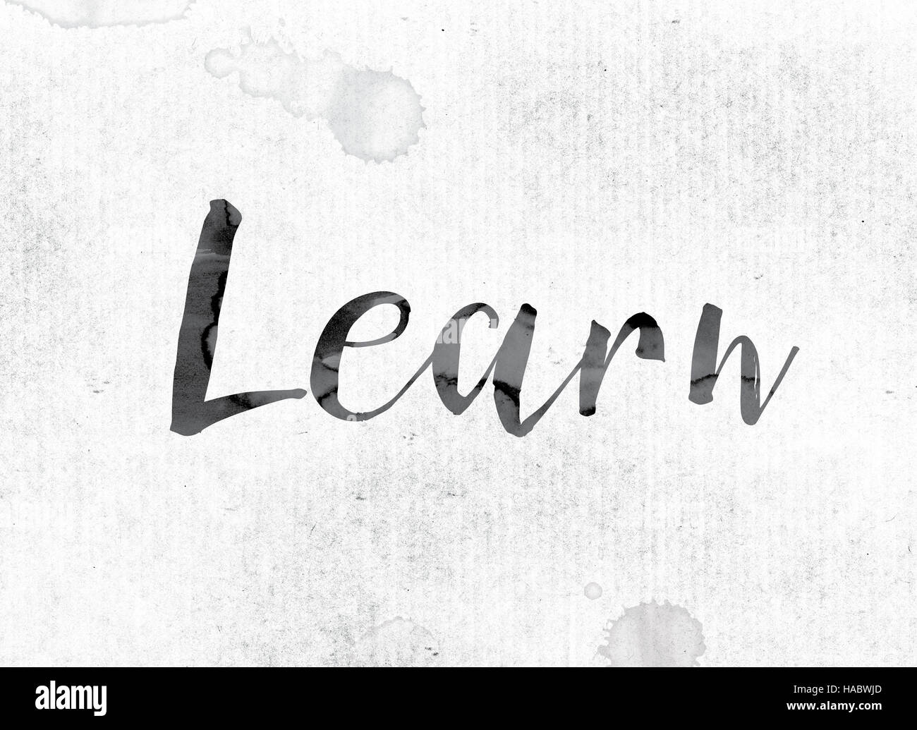 The word "Learn" concept and theme painted in watercolor ink on a white ...